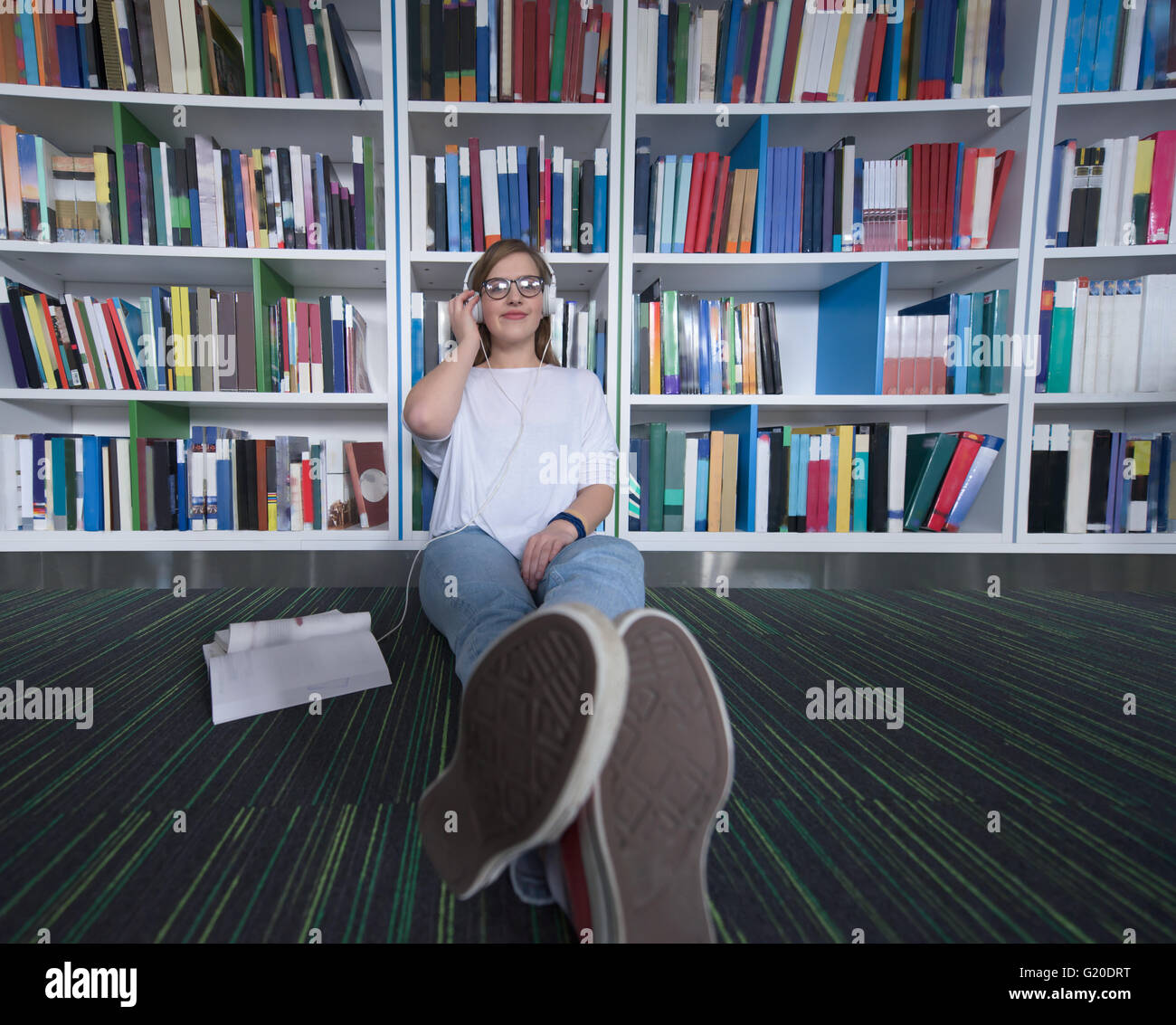 female student study in school library, using tablet and searching for ...