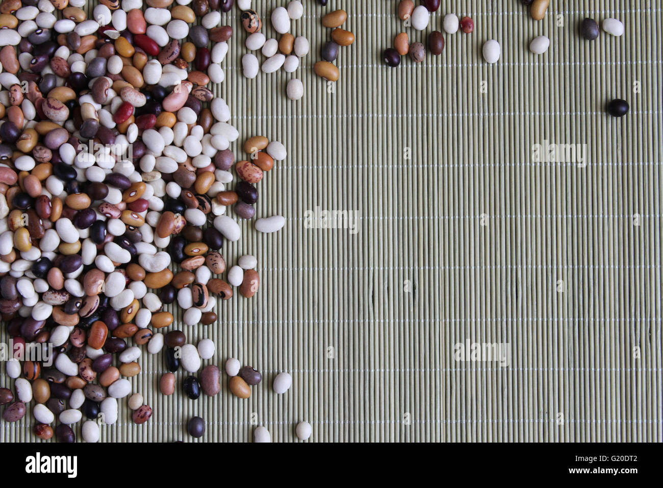Pile of colorful dried beans on straw mat with room for text Stock ...