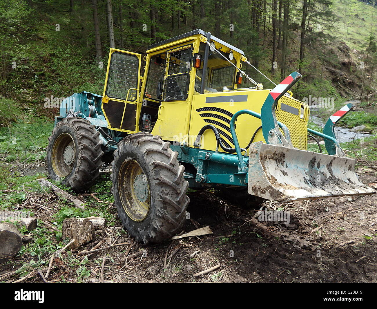 yellow special forestry tractors, Tractor in the woods Stock Photo - Alamy