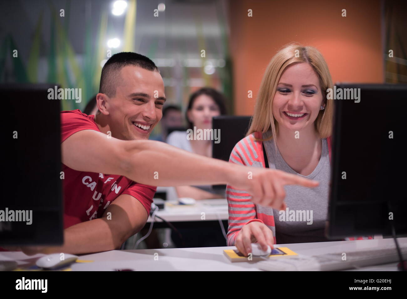 technology students group in computer lab school classroom working on ...