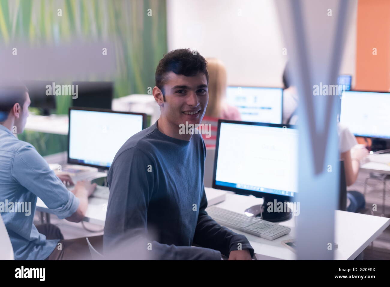 technology students group in computer lab school classroom working on ...