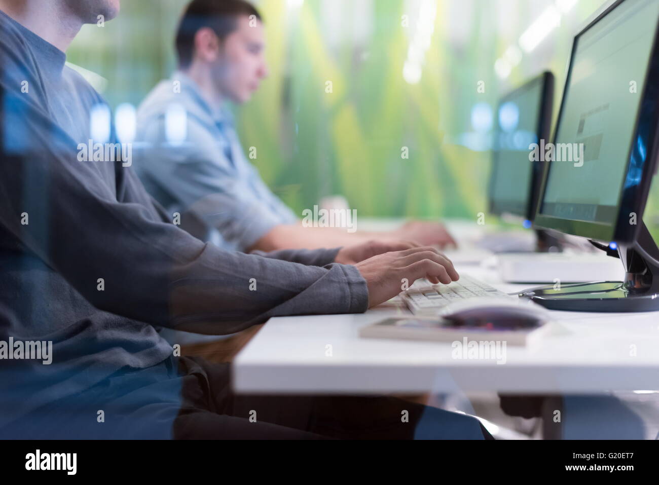 technology students group in computer lab school classroom working on ...