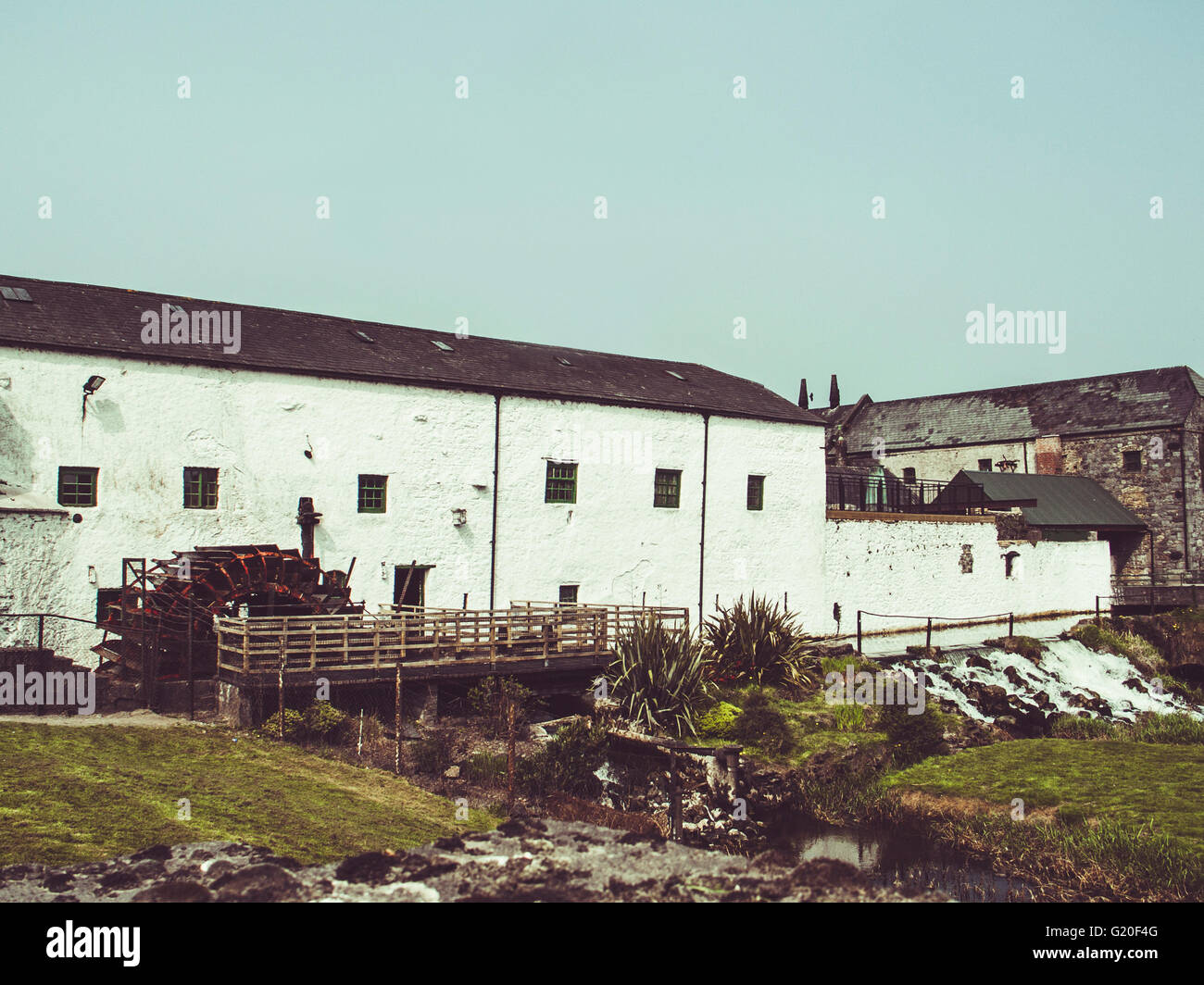 House with mill Stock Photo - Alamy