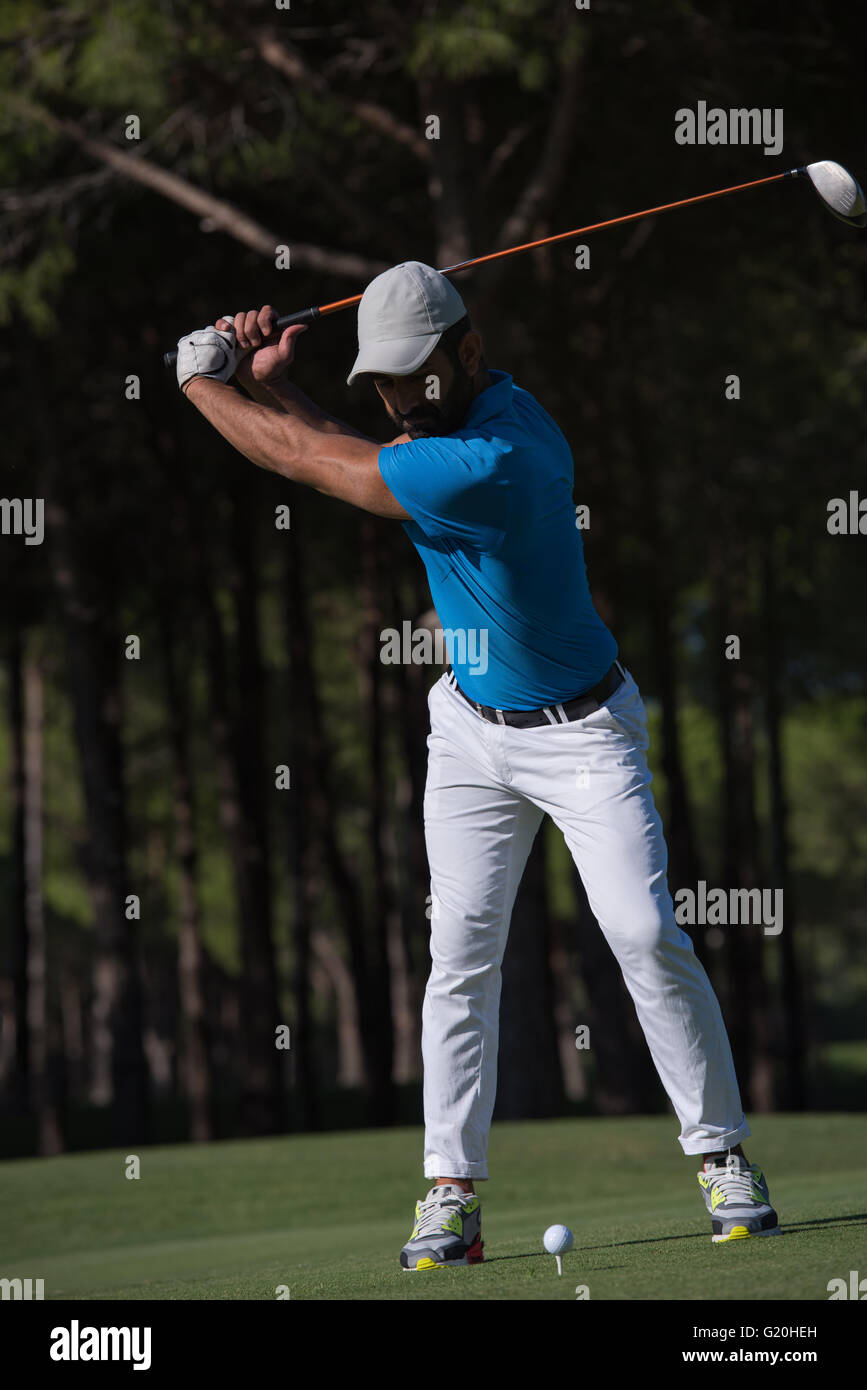 golf player hitting shot with club on course at beautiful morning Stock ...
