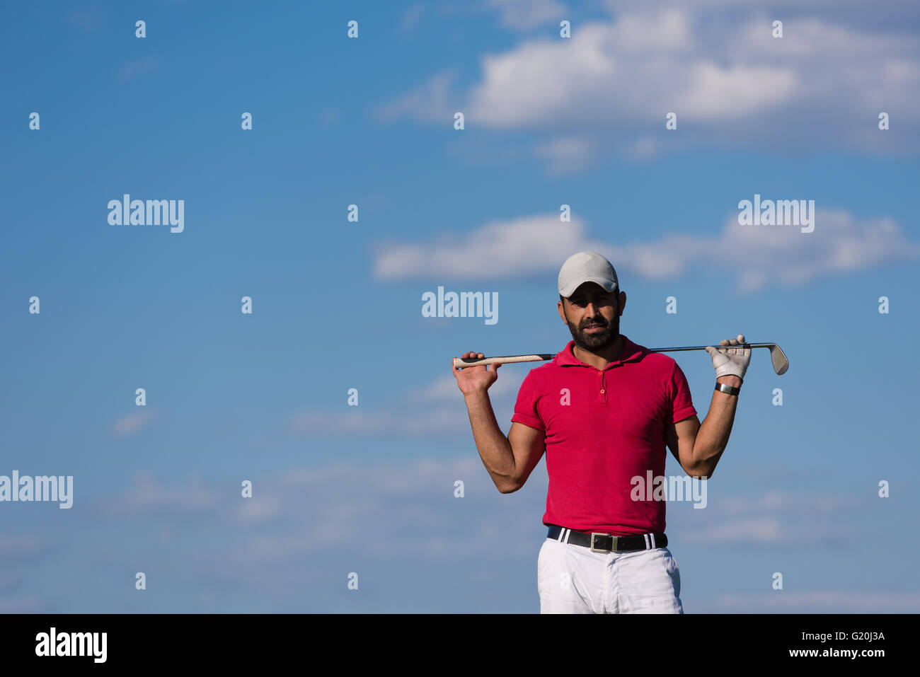 handsome middle eastern golf player portrait at course at sunny day ...