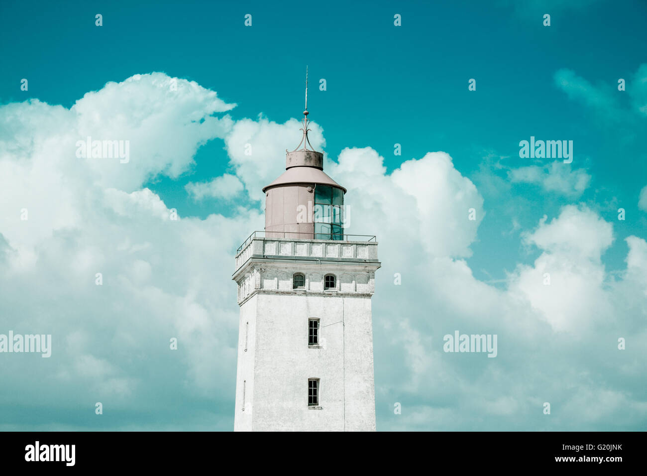 Lighthouse and wild coastline Stock Photo - Alamy