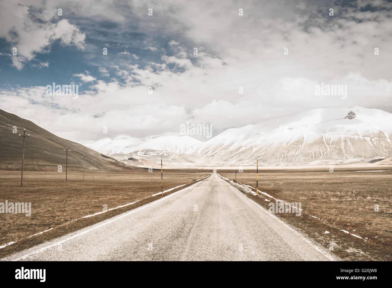 Wild road in a valley Stock Photo - Alamy