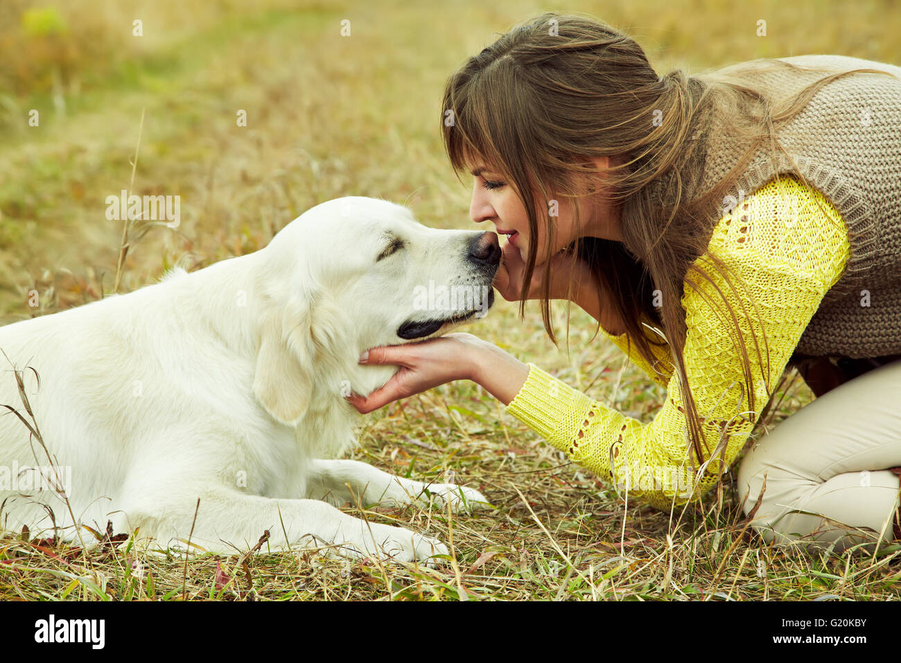 Labrador retriever with owner Stock Photo - Alamy