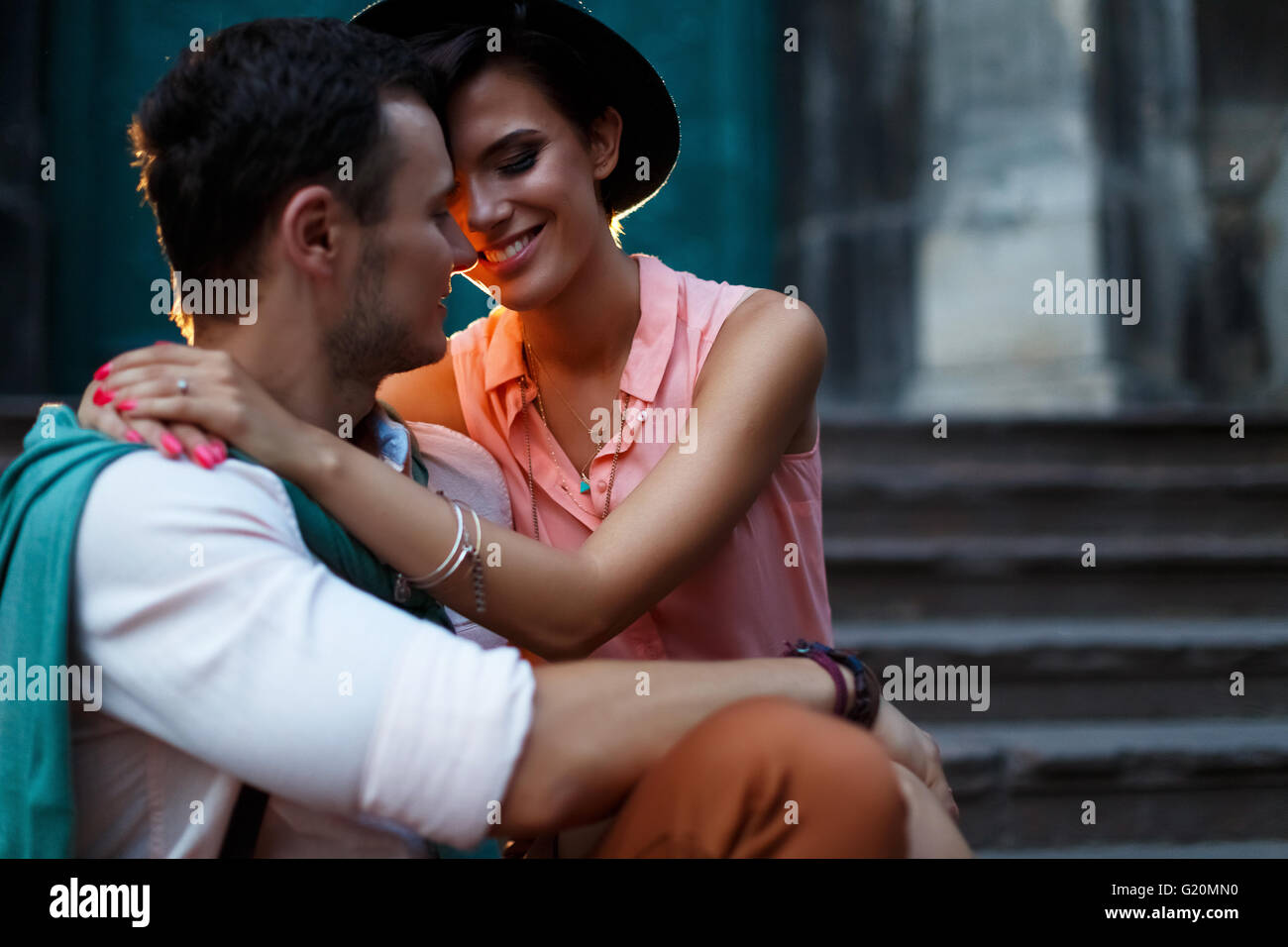 embrace couple is hugging on the background old door Stock Photo - Alamy