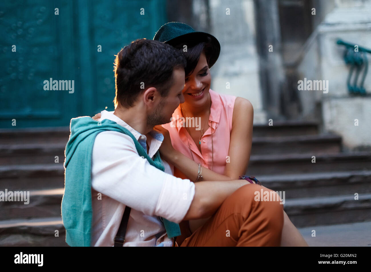 embrace couple is hugging on the background old door Stock Photo - Alamy