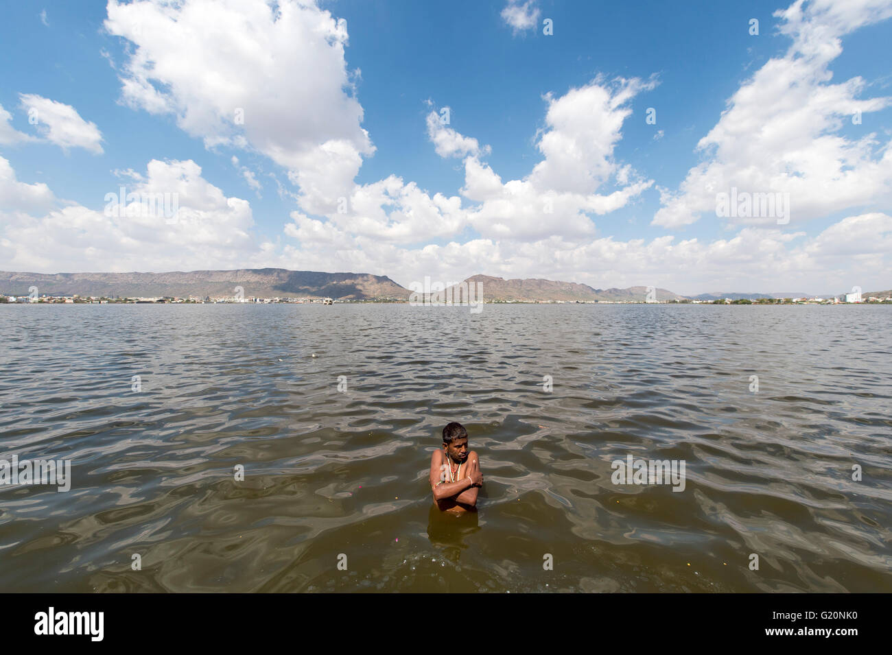 An Indian man having a bath in Ana Sagar lake in Ajmer, India after ...