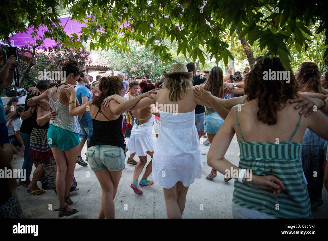 people playing music and dancing at Ikaria island festival, Greece ...