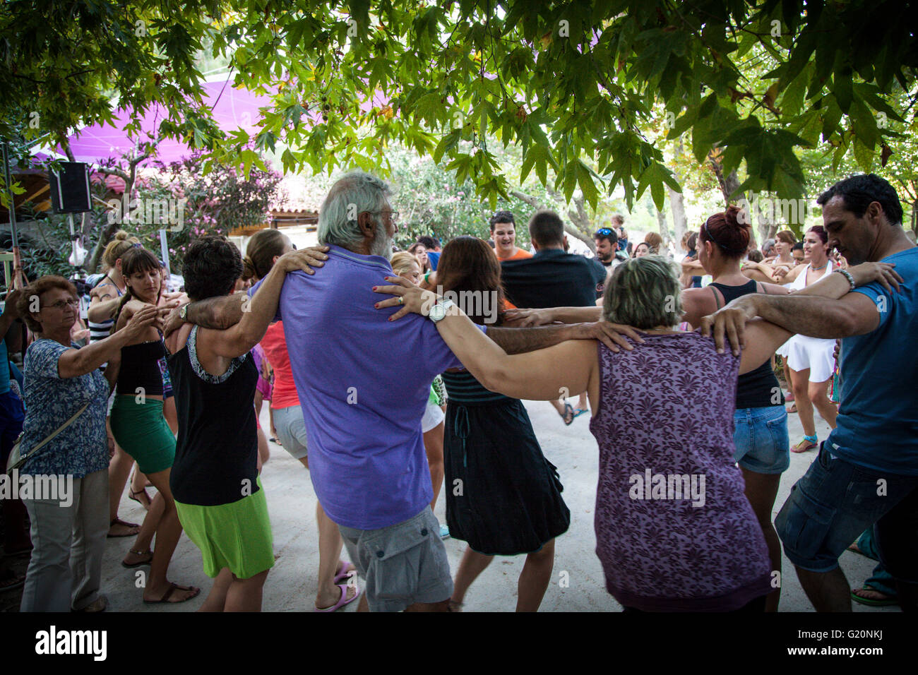 people playing music and dancing at Ikaria island festival, Greece ...