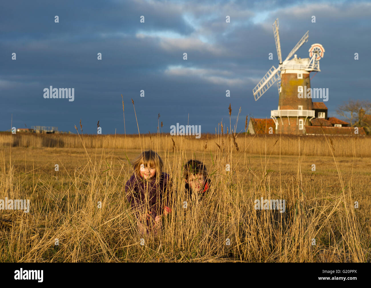 Children at Cley Norfolk winter Stock Photo - Alamy