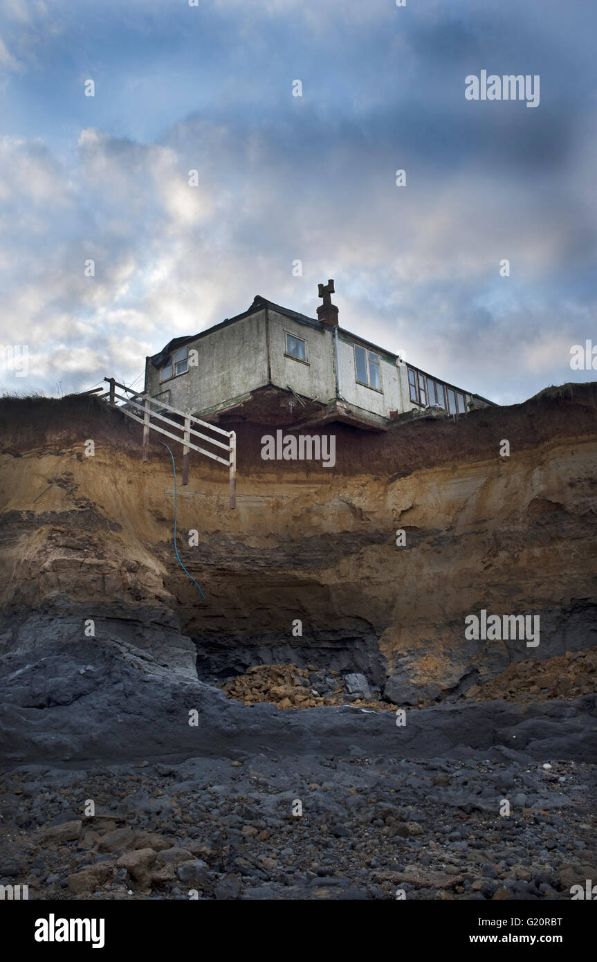 House on edge of cliff after erosion from Storm damage after North Sea ...
