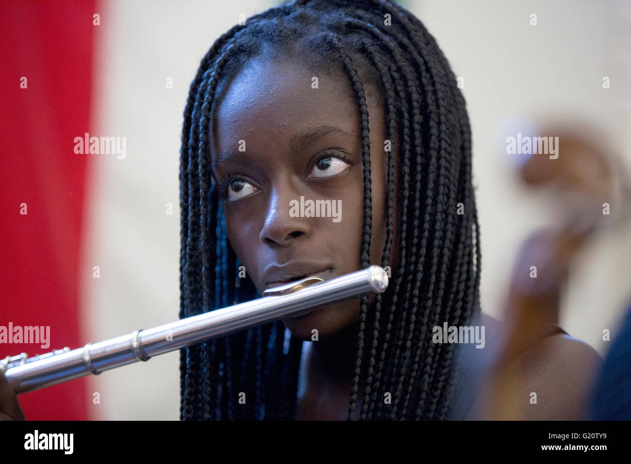 Young woman playing flute hi-res stock photography and images - Alamy