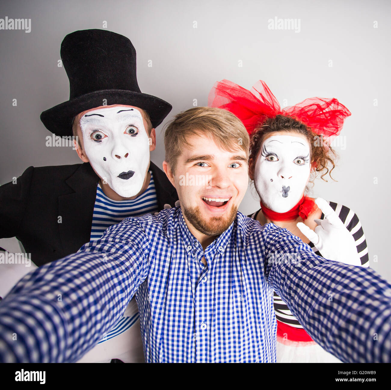 A young man and Funny couple of mimes taking a selfie photo Stock Photo ...
