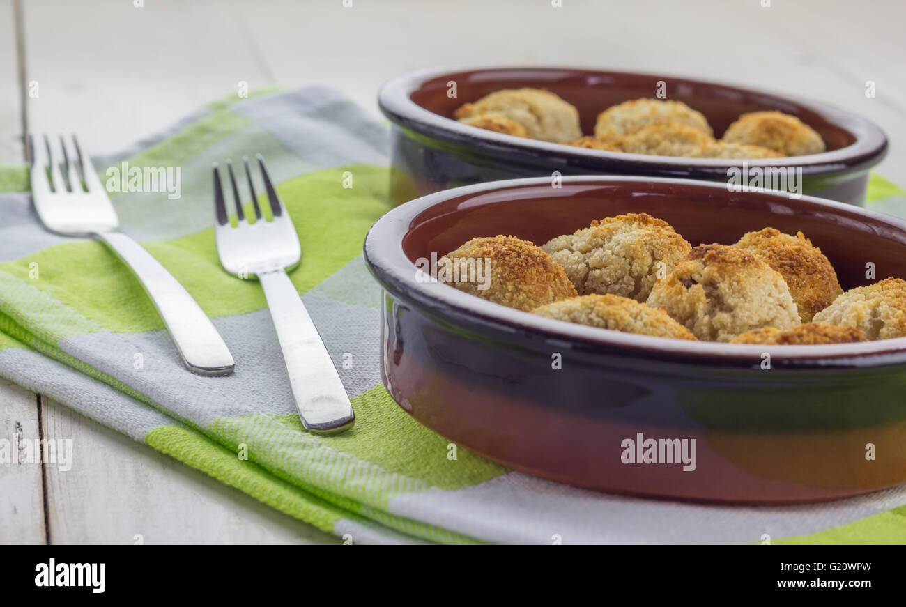 Tapas, Spanish ham croquettes on a white table Stock Photo - Alamy