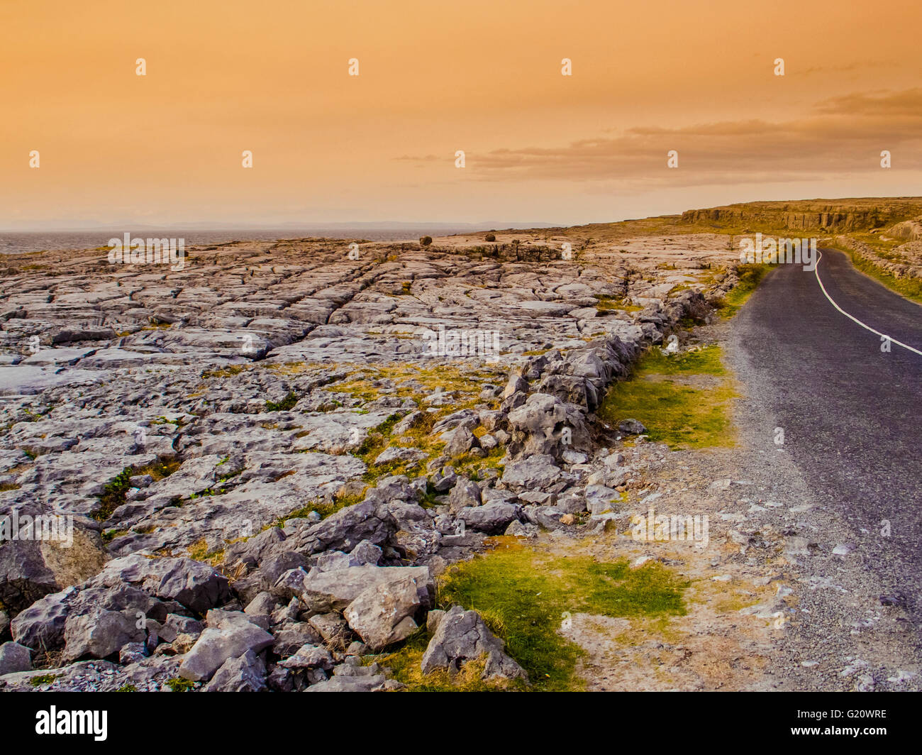 Sunset and lonely road Stock Photo - Alamy