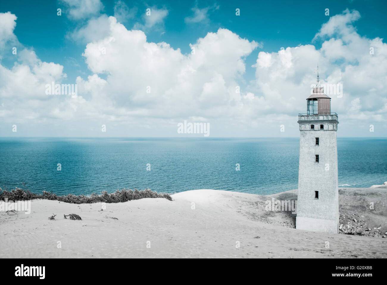 Lighthouse and wild coastline Stock Photo - Alamy