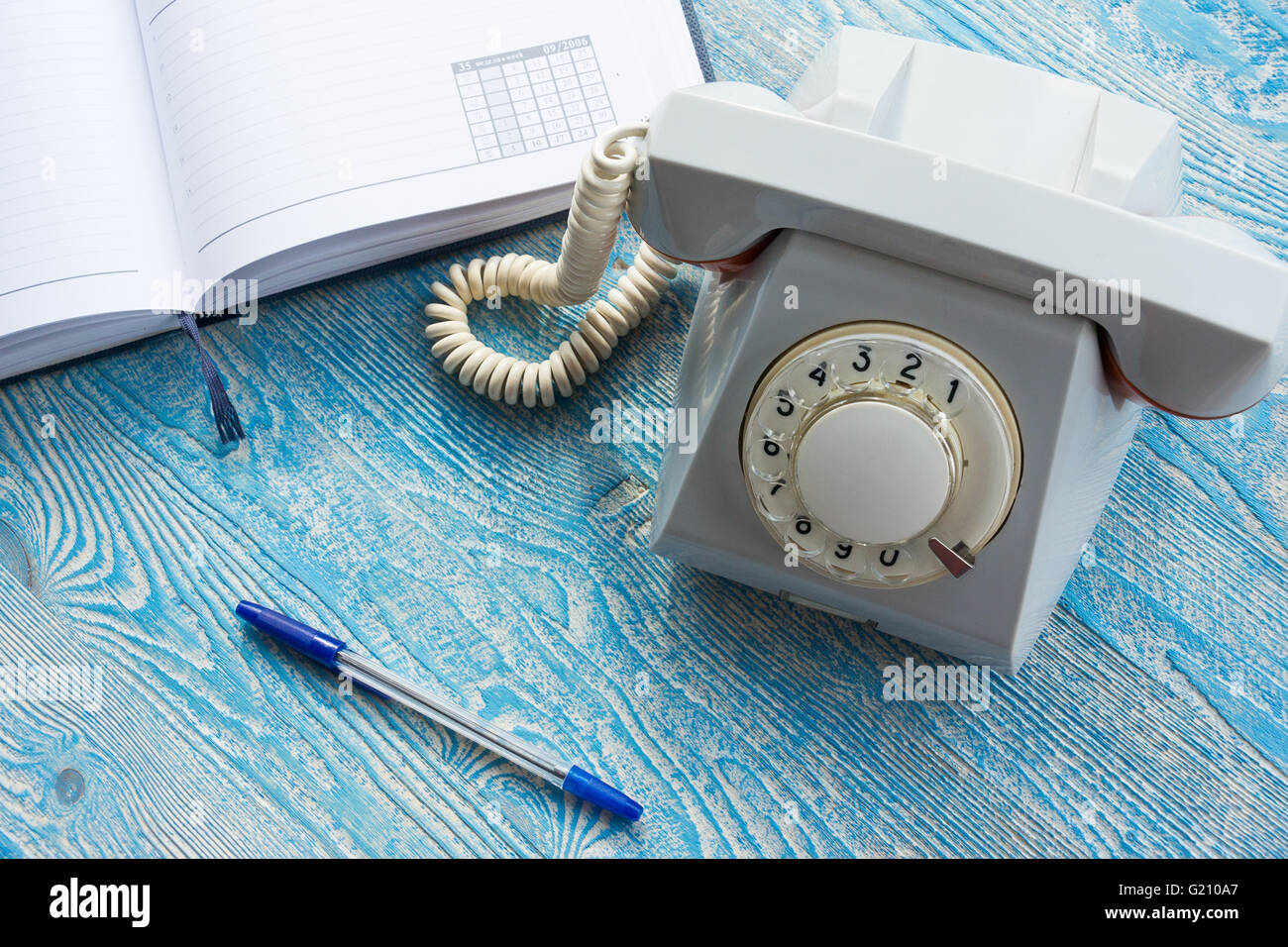 The photo depicts a landline phone with a notebook Stock Photo - Alamy