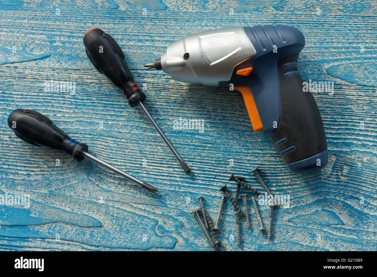 The photo shows the screwdriver and screws Stock Photo - Alamy