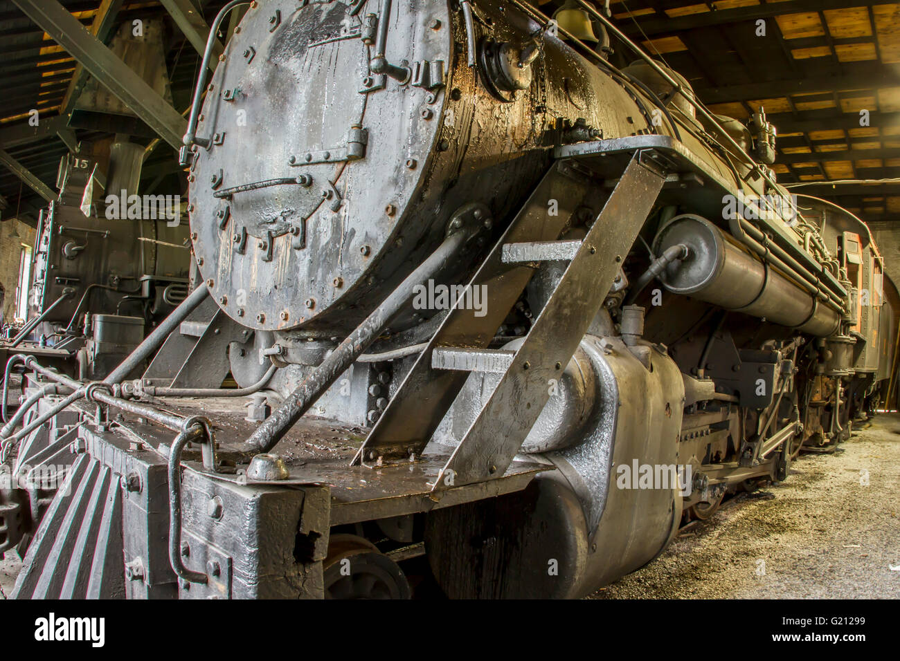 Vintage railroad locomotive engines in old roundhouse Stock Photo - Alamy