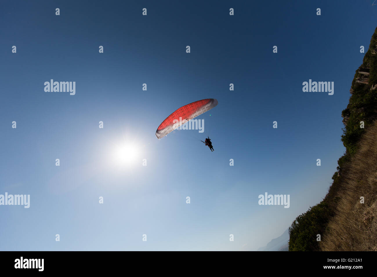 Paragliding over mountains in Italy Stock Photo - Alamy