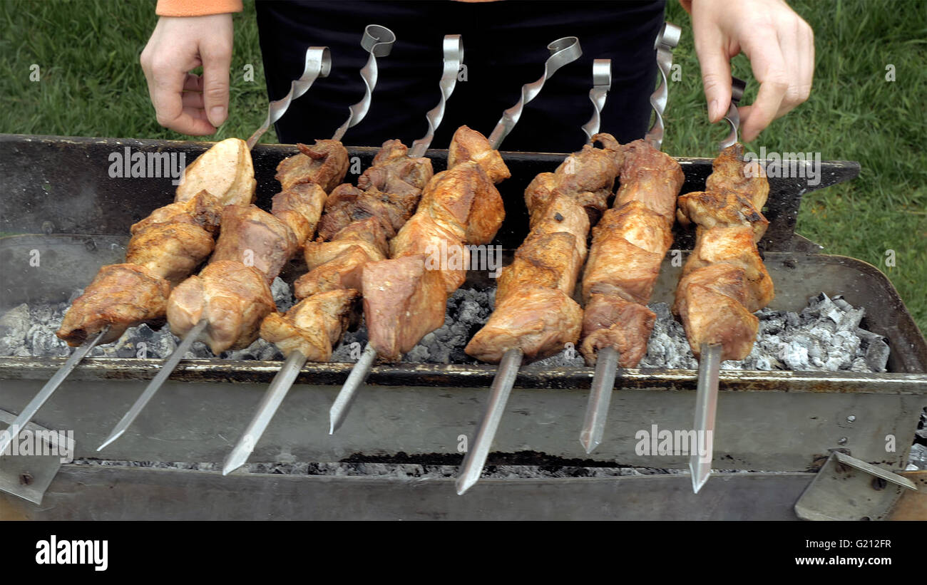 Barbeque skewers with meat cooking on brazier Stock Photo - Alamy