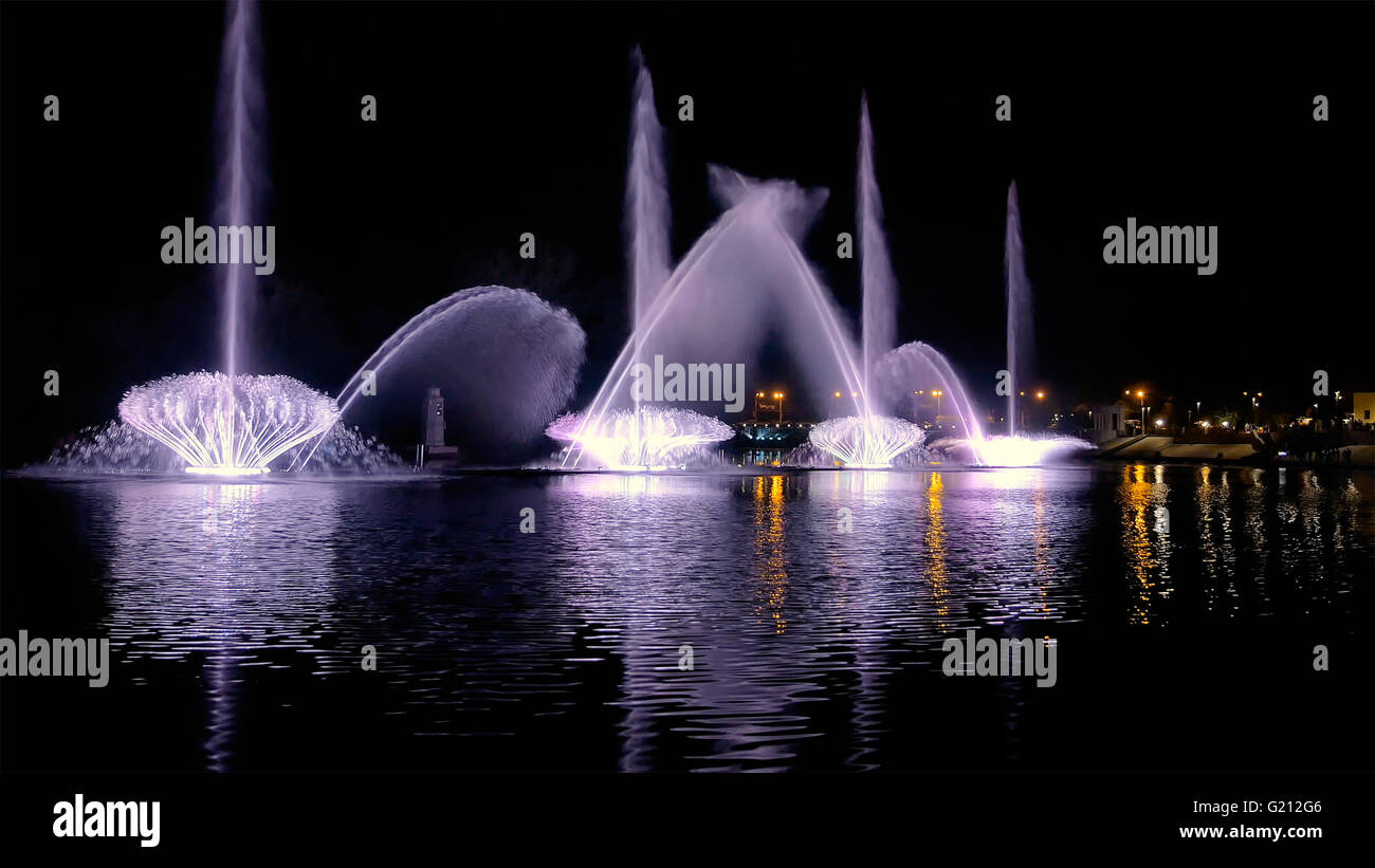 Bright fountain on the water pond or river Stock Photo - Alamy