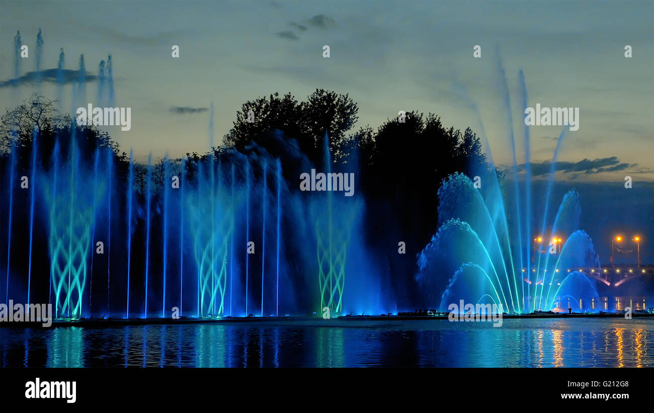 Colorful bright fountain with beautiful reflection Stock Photo - Alamy