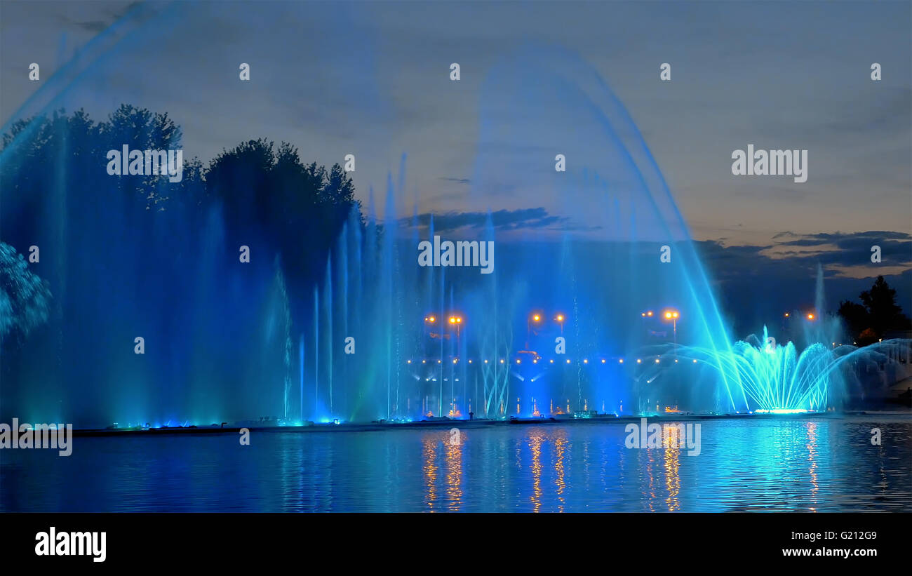 Colorful bright fountain with beautiful reflection Stock Photo - Alamy