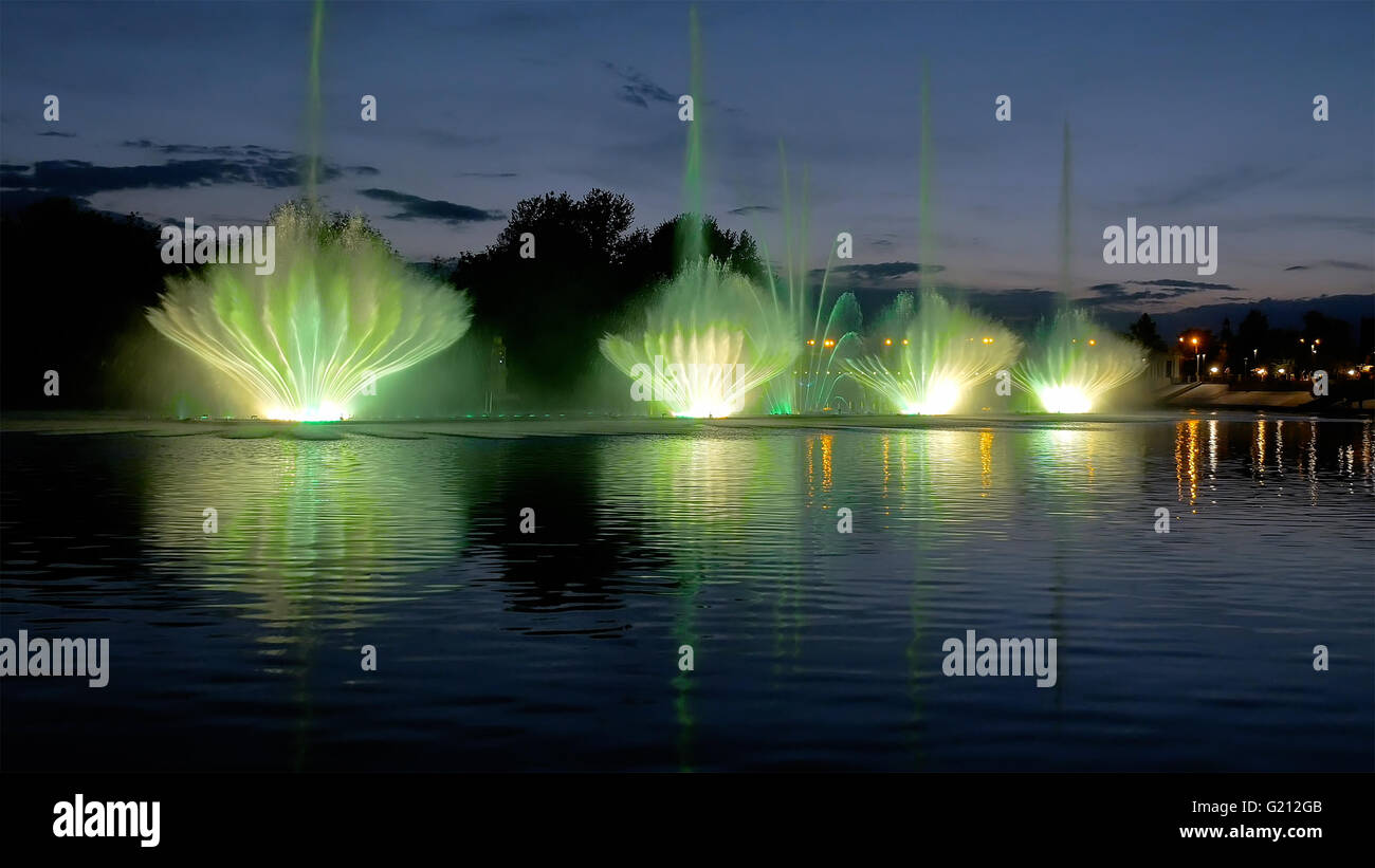 Colorful bright fountain with beautiful reflection Stock Photo - Alamy