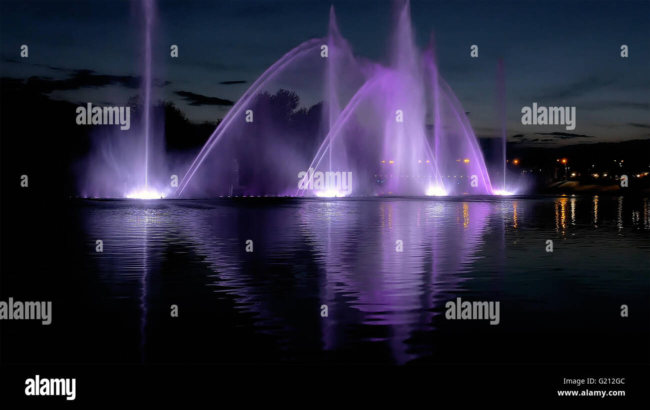 Colorful bright fountain with beautiful reflection Stock Photo - Alamy