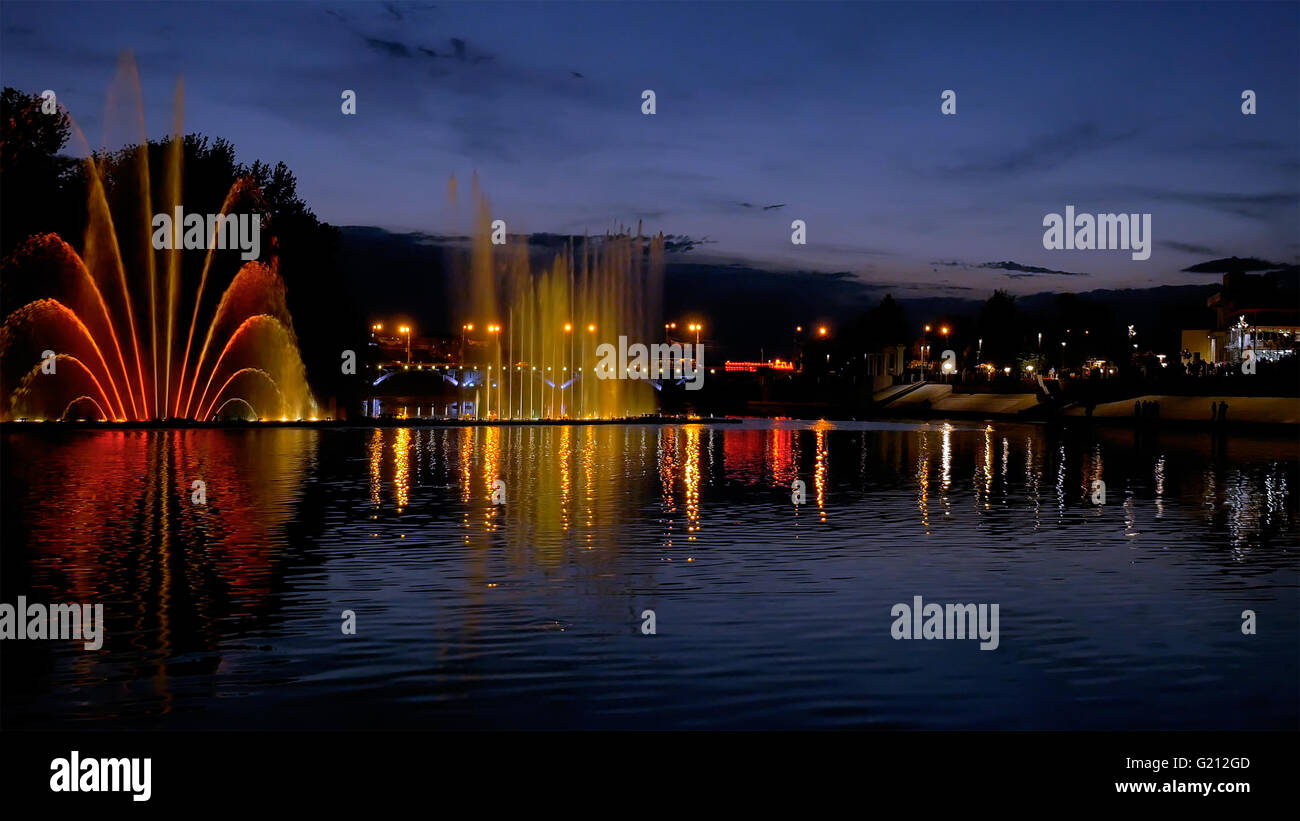 Colorful bright fountain with beautiful reflection Stock Photo - Alamy