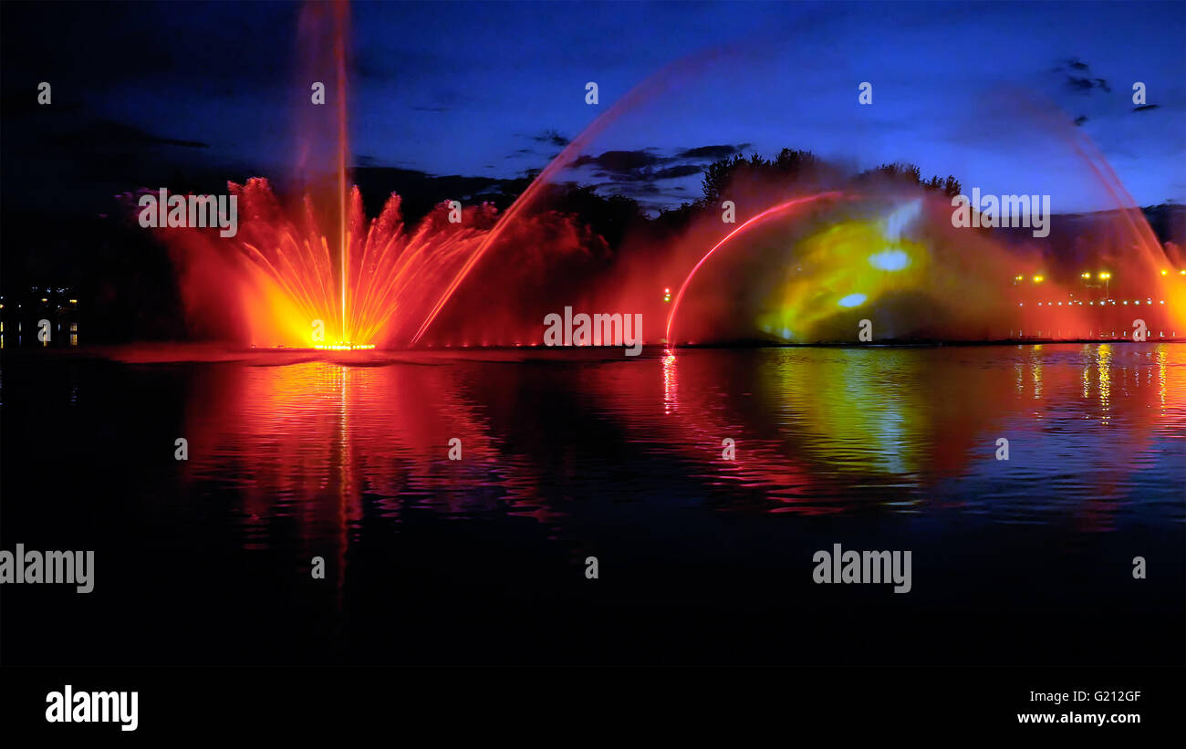 Colorful bright fountain with beautiful reflection Stock Photo - Alamy