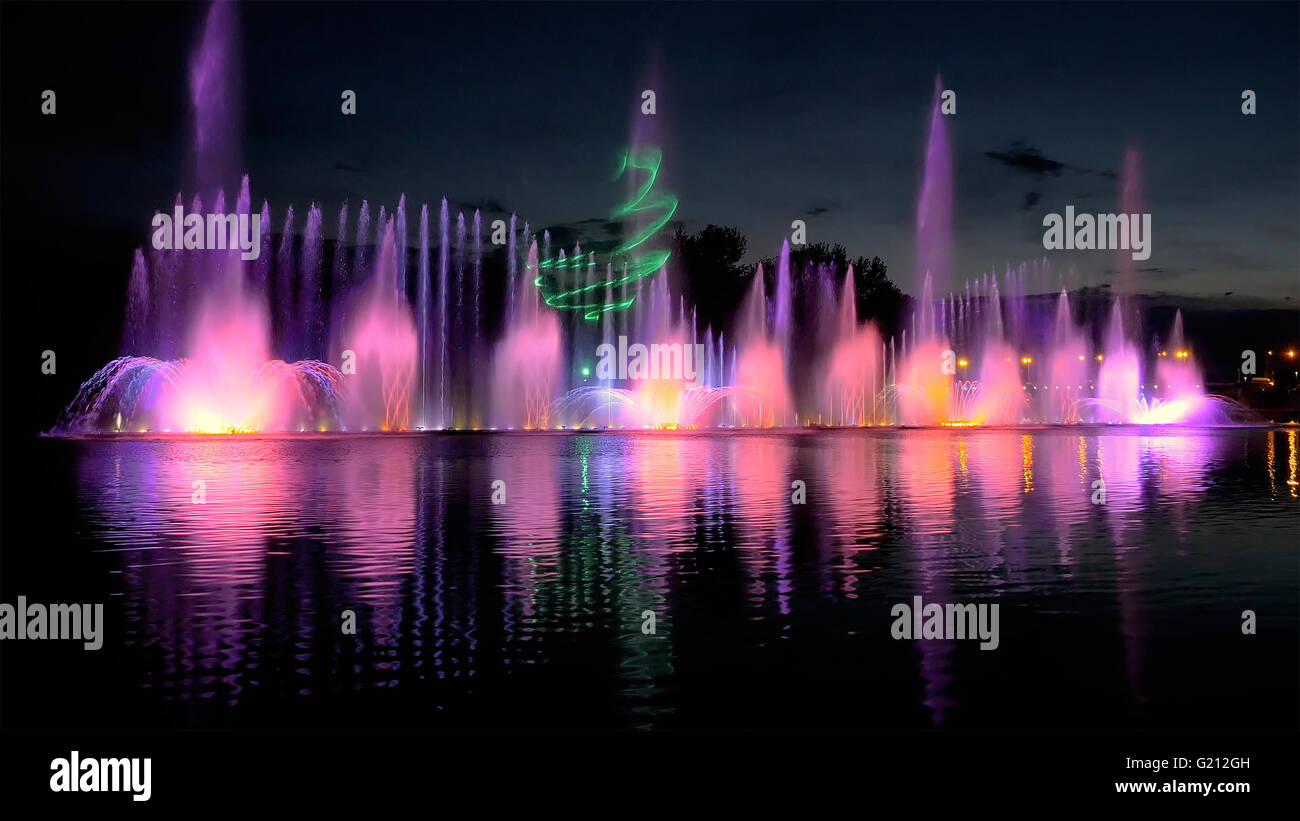 Colorful bright fountain with beautiful reflection Stock Photo - Alamy