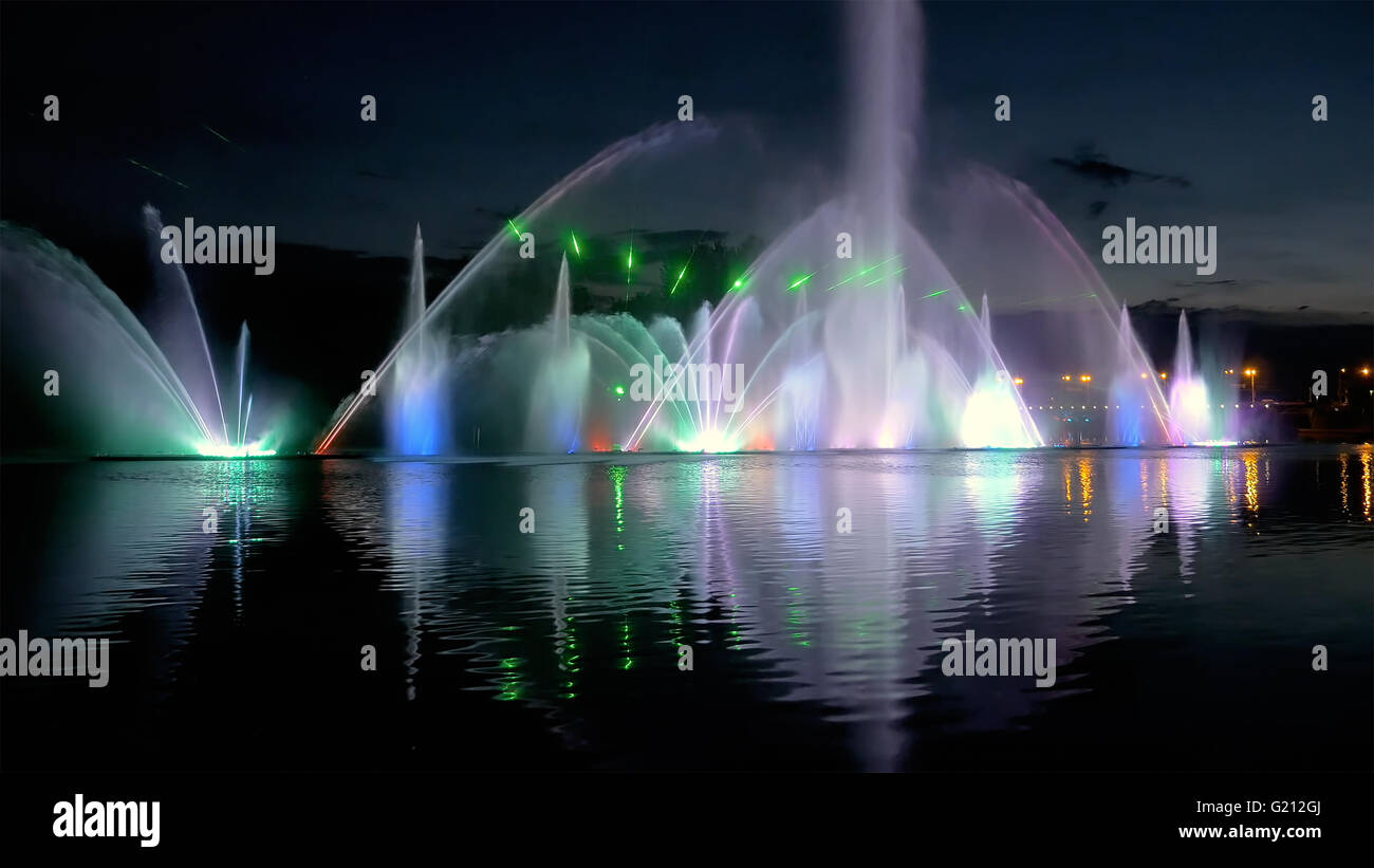 Colorful bright fountain with beautiful reflection Stock Photo - Alamy