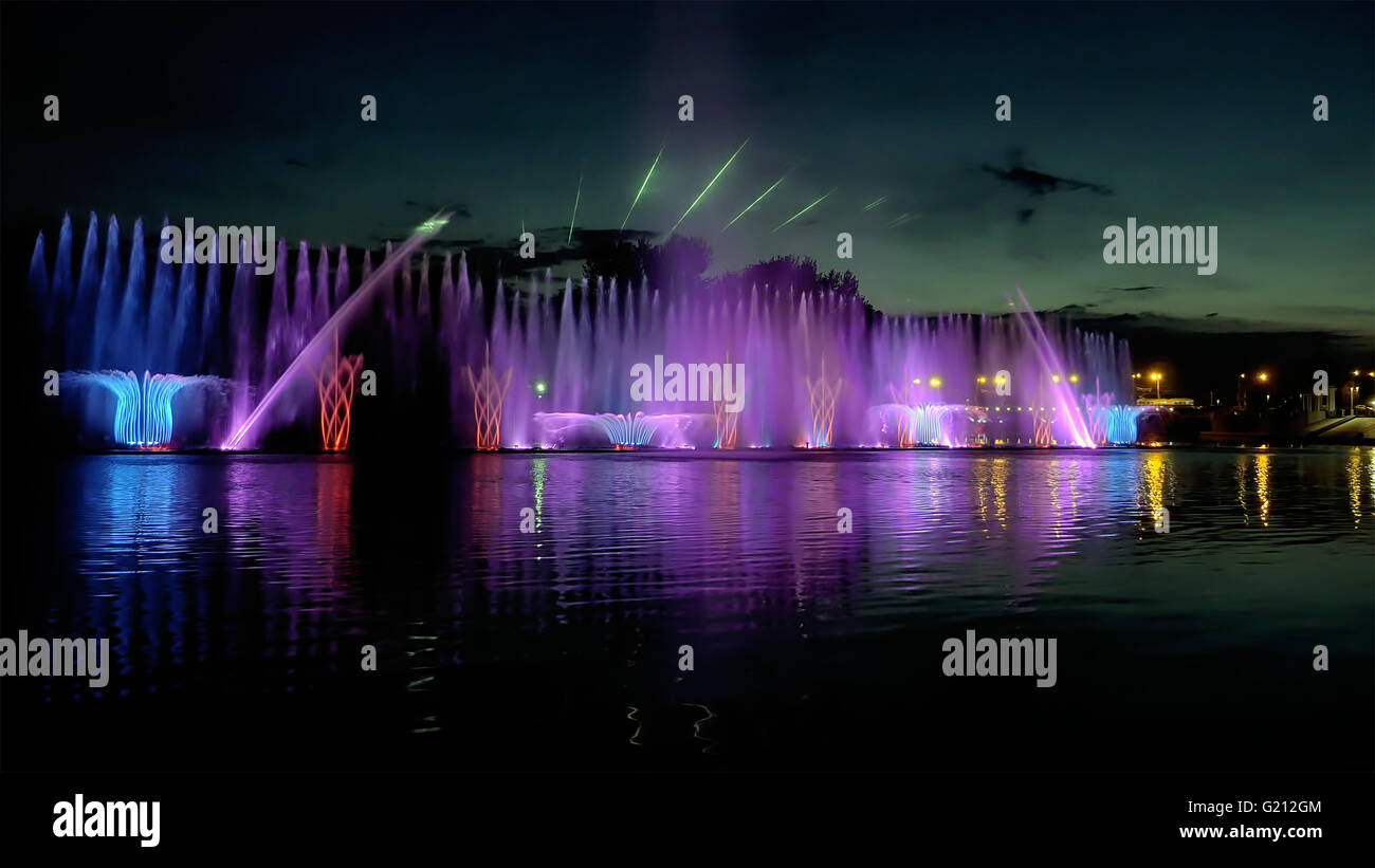 Colorful bright fountain with beautiful reflection Stock Photo - Alamy