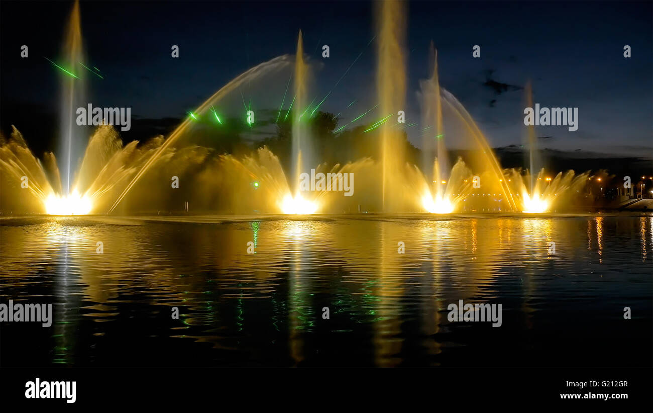 Colorful bright fountain with beautiful reflection Stock Photo - Alamy