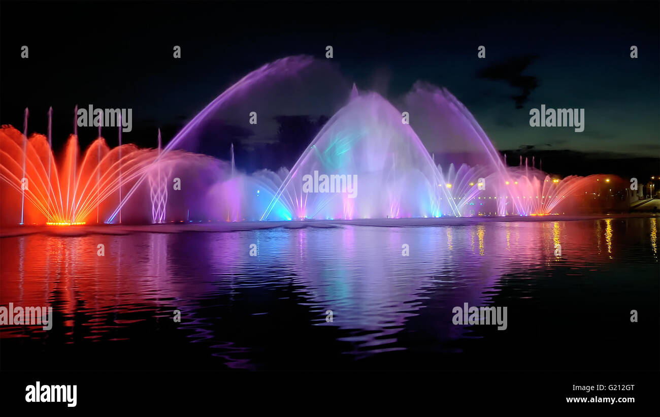 Colorful bright fountain with beautiful reflection Stock Photo - Alamy
