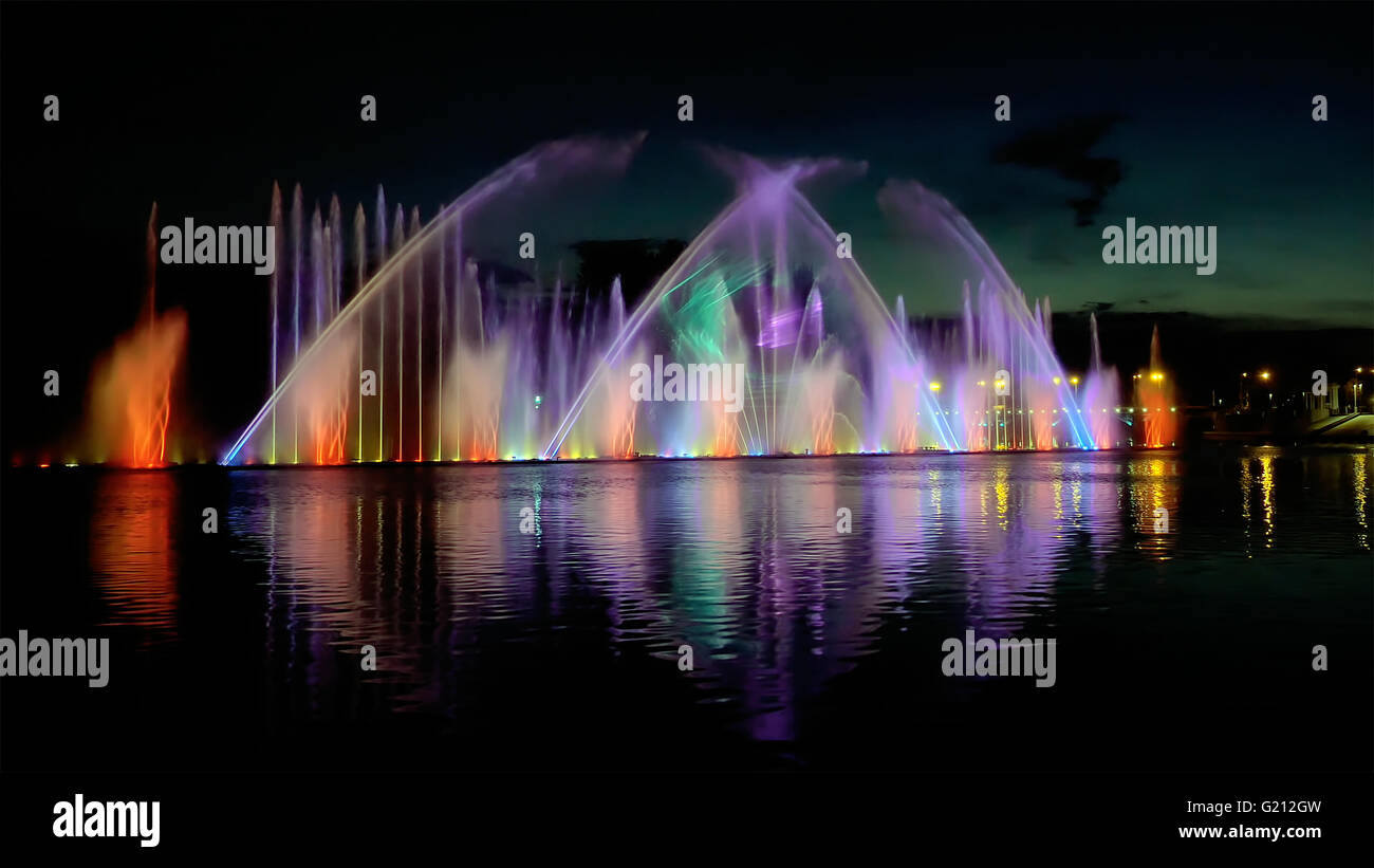 Colorful bright fountain with beautiful reflection Stock Photo - Alamy