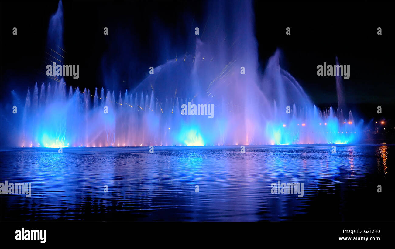 Colorful bright fountain with beautiful reflection Stock Photo - Alamy