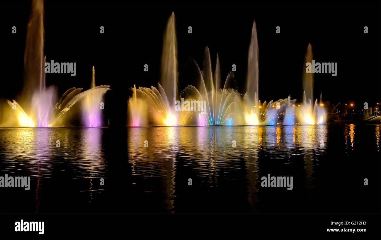 Colorful bright fountain with beautiful reflection Stock Photo - Alamy