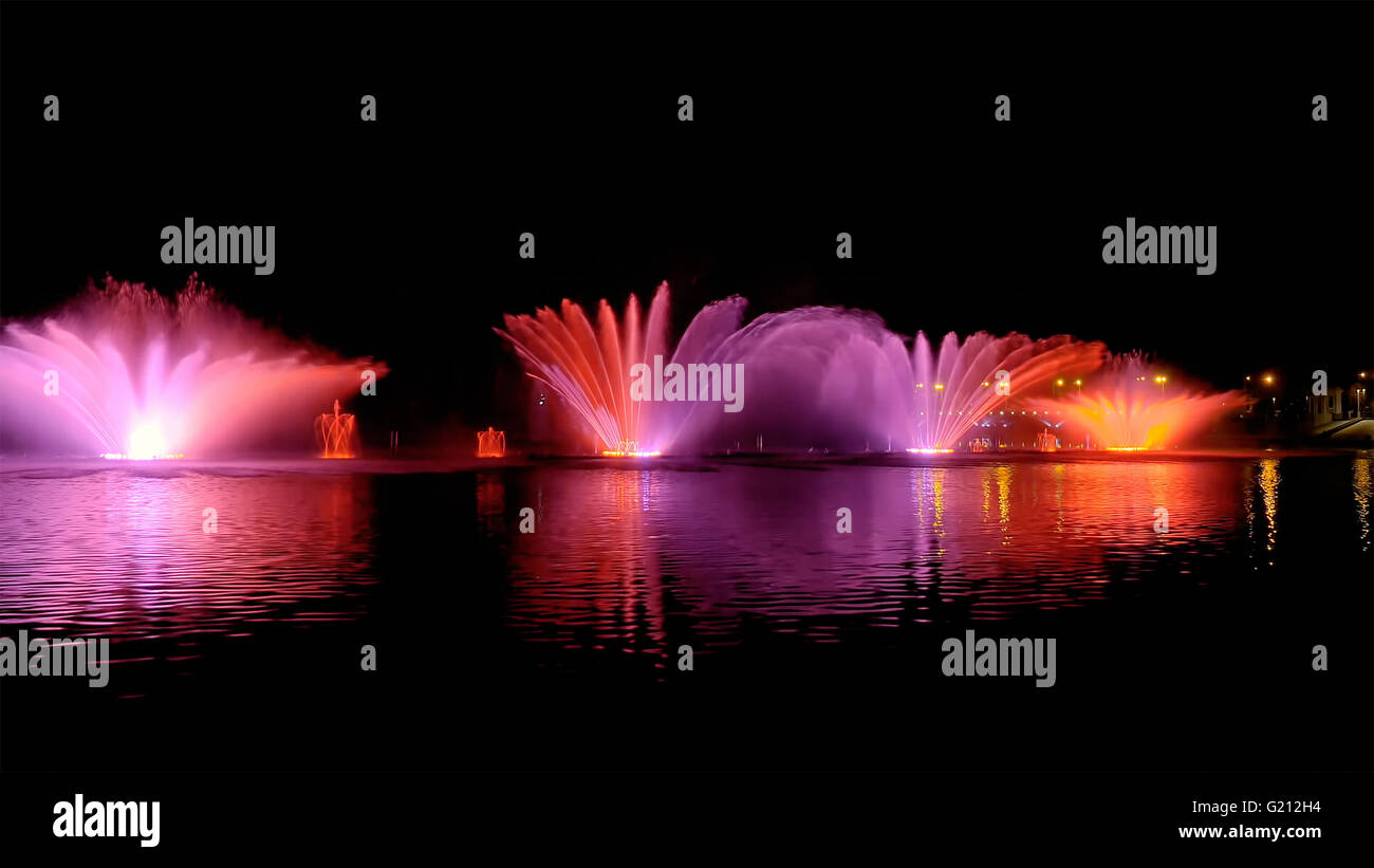 Colorful bright fountain with beautiful reflection Stock Photo - Alamy