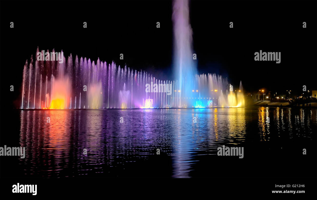 Colorful bright fountain with beautiful reflection Stock Photo - Alamy