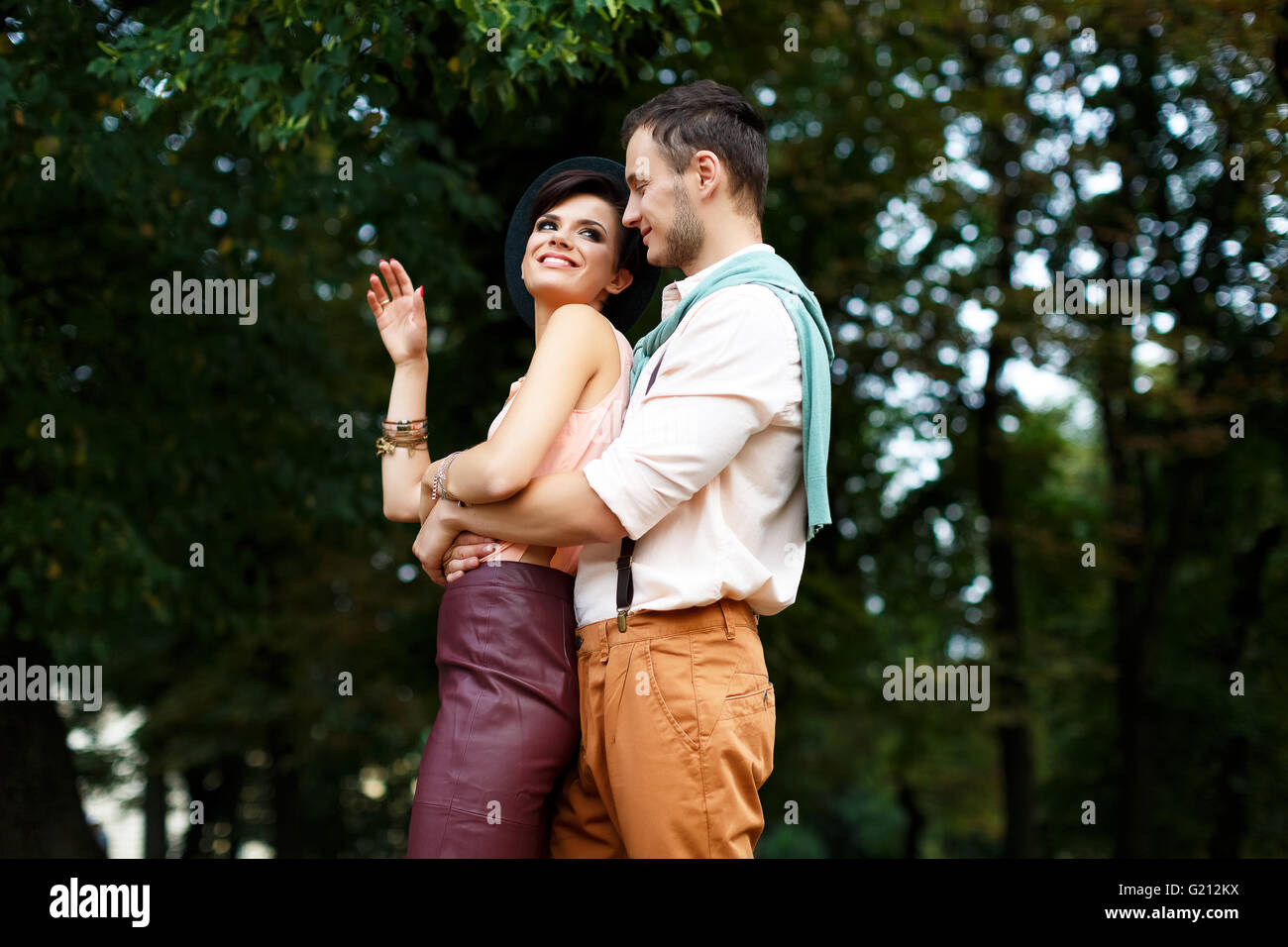 Young happy couple hugging and laughing Stock Photo - Alamy