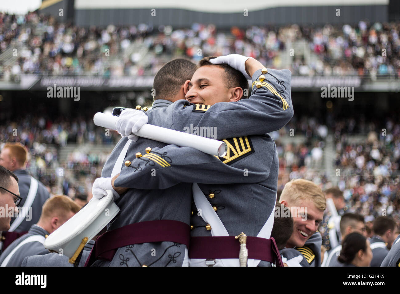 West Point, USA. 21st May, 2016. Graduating cadets hug each other ...