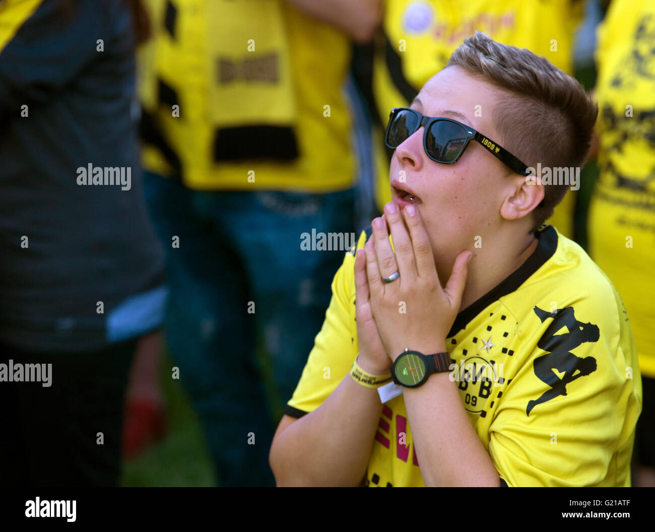Berlin, Germany. 21st May, 2016. A Borussia Dortmund supporter watches ...