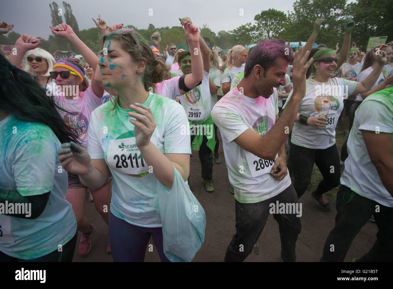 Dancing people covered in paint at the Color Run Stock Photo - Alamy